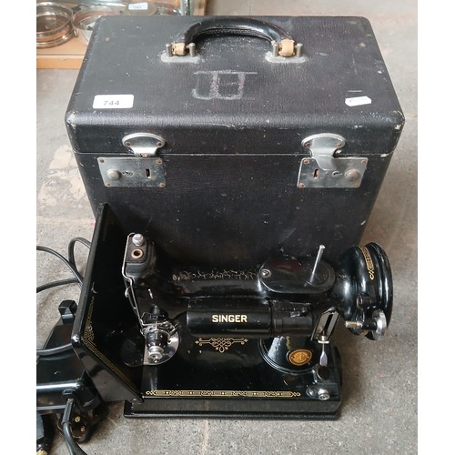 A Singer 221K featherweight sewing machine.