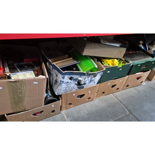 Nine boxes of mixed household items.