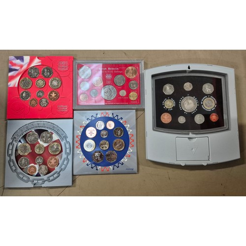 A group of assorted UK coin sets to include 2000,2003,2005 & 2006 etc.