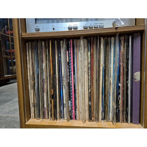 A Prinz stacking music system, with cabinet, various LPs, singles and 2 ...