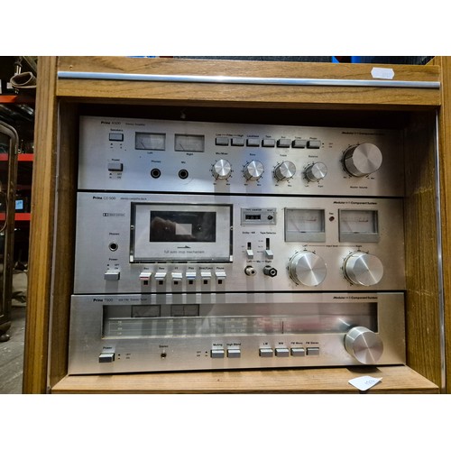 A Prinz stacking music system, with cabinet, various LPs, singles and 2 ...