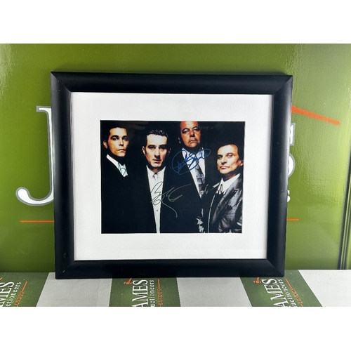 A framed and glazed signed photo of the four main actors from ...