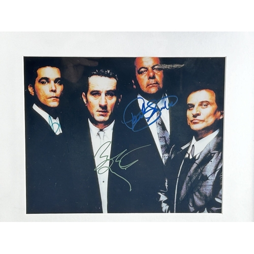 A framed and glazed signed photo of the four main actors from ...