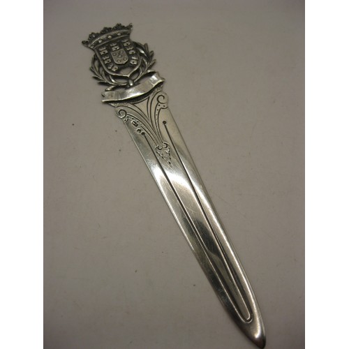 A silver bookmark, the top fashioned as a European coat of arms ...