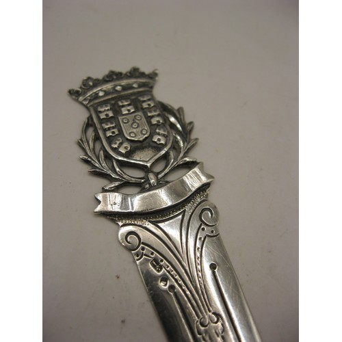 A silver bookmark, the top fashioned as a European coat of arms ...