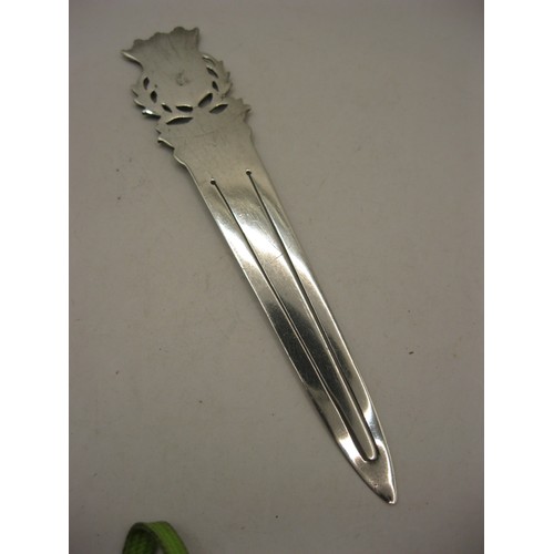 A silver bookmark, the top fashioned as a European coat of arms ...