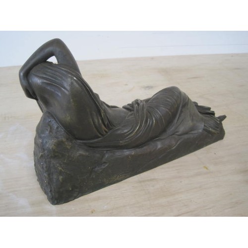 A Bronze Figure of a Reclining Lady
