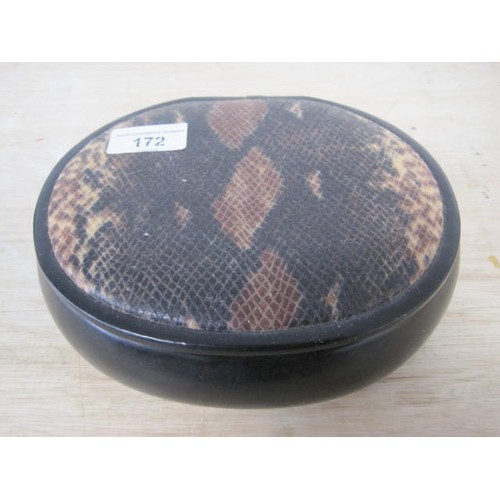 A vintage circular jewellery box containing mainly costume earrings ...