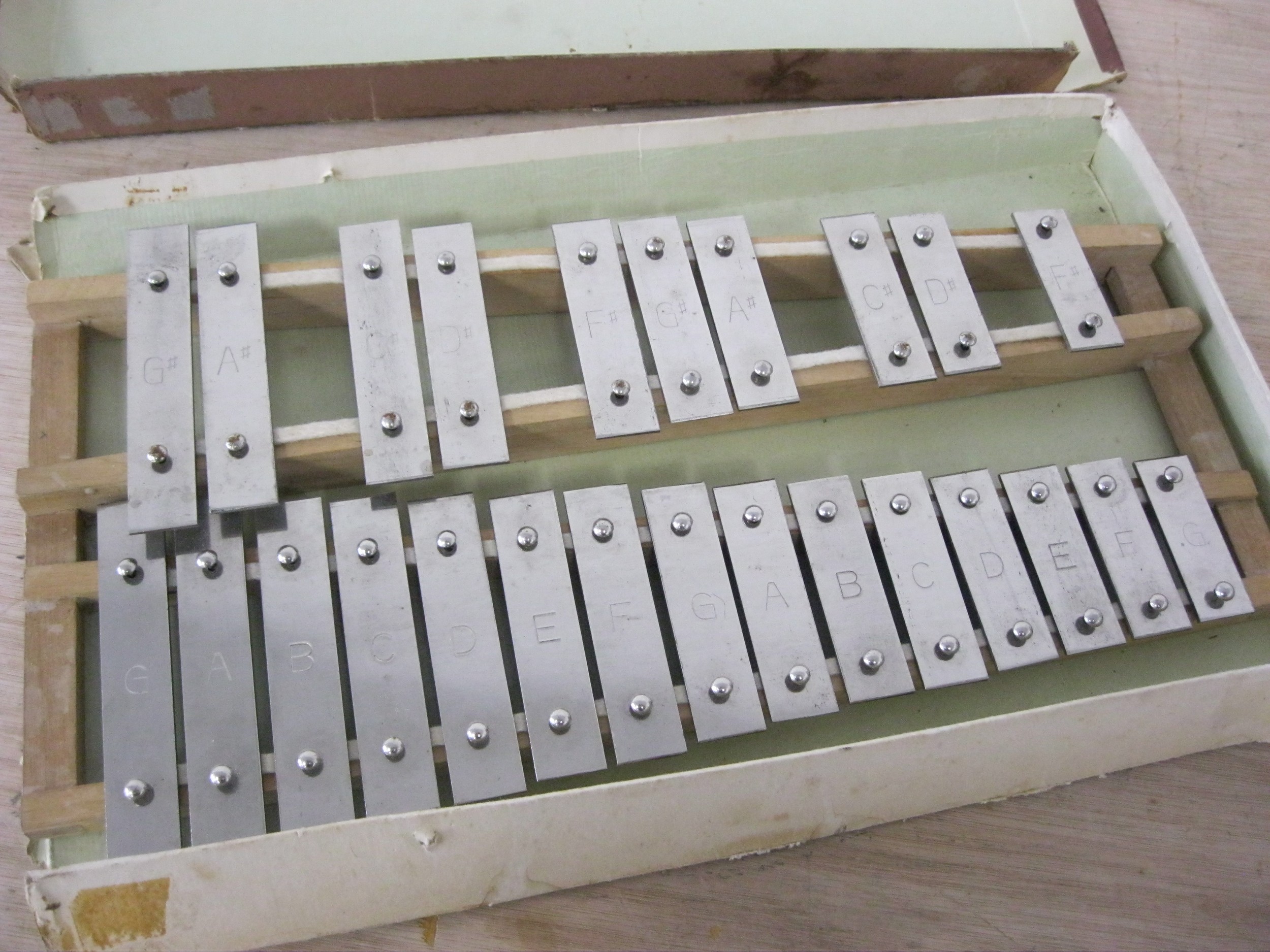 A vintage glockenspiel in original box, in good order but with no sticks