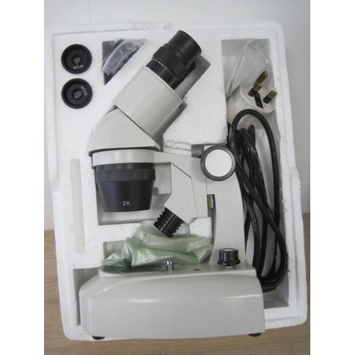 A boxed binocular microscope by Seben, in mint condition in original ...