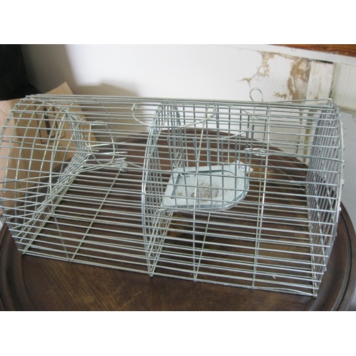 A humane trap door rodent trap in good order