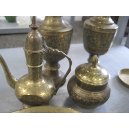 Nine items of Middle and Far eastern brassware, including a pair of ...