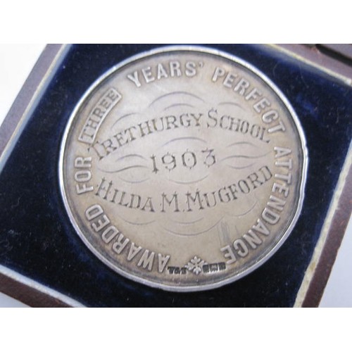 A hall marked silver St Austell school board prize medal in leather case