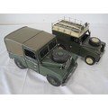 A pair of relatively modern tin-plate models of Land Rovers, believed ...