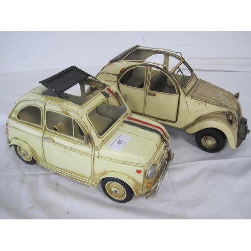 A pair of tin plate cars, one a Fiat 500, the other a Citroen 2CV