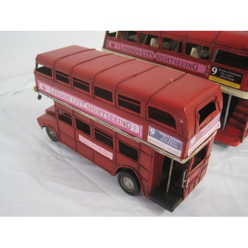 Two metal tin red buses and other