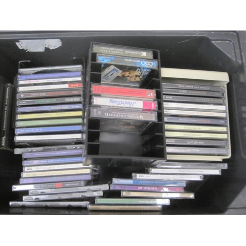 A box of assorted CDs of various genres