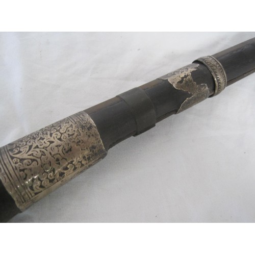 An antique Jezail flintlock musket with ornate bone inlay and likely ...