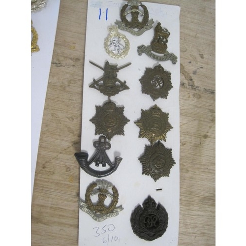 Two cards of British Army cap and other badges including RAMC, Royal ...