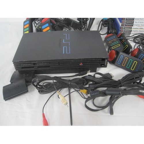 Playstation 2 console with accessories and sixteen PS2 games (includes ...