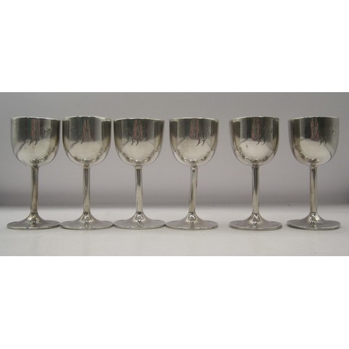 A set of six silver toasting goblets. Each standing at 7cm and engraved ...