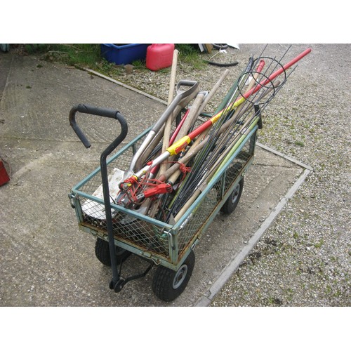 A pull-along 4 wheel garden trolley full of garden tools mostly in good ...
