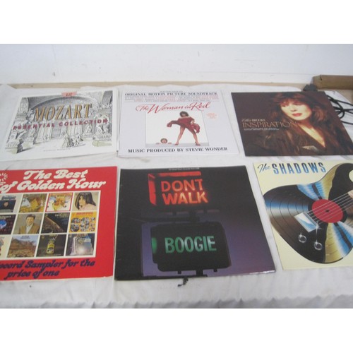 A crate containing a selection of vinyl LPs including 1980s