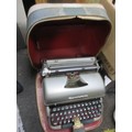 A vintage Remington Quiet Writer portable typewriter in carry case