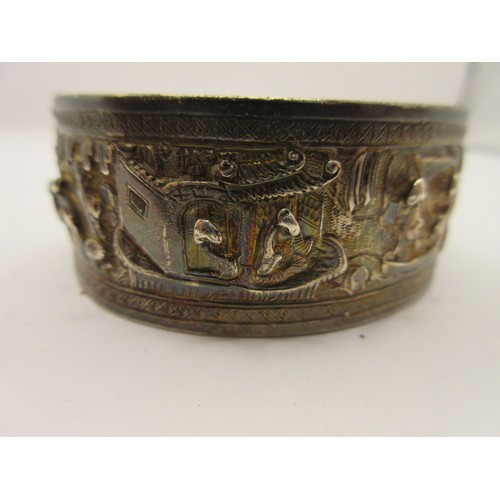 A Chinese or far eastern white metal bangle (acid test positive for ...