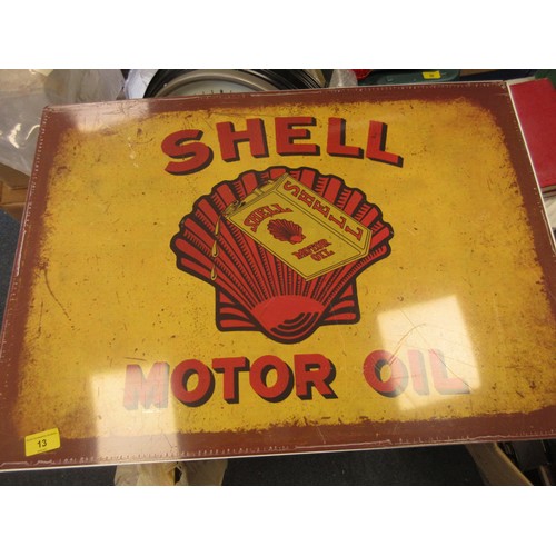A vintage-style Shell Motor Oil metal sign