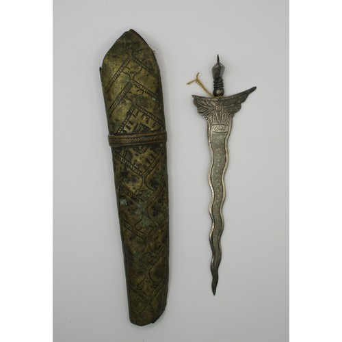 A decorative dagger with engraved wavy blade, Arabic script, the ...