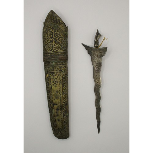 A decorative dagger with engraved wavy blade, Arabic script, the ...