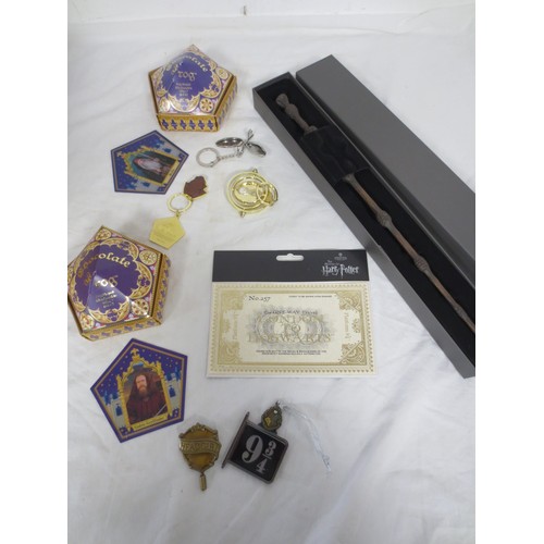 A small assortment of Harry Potter items including a boxed wand etc