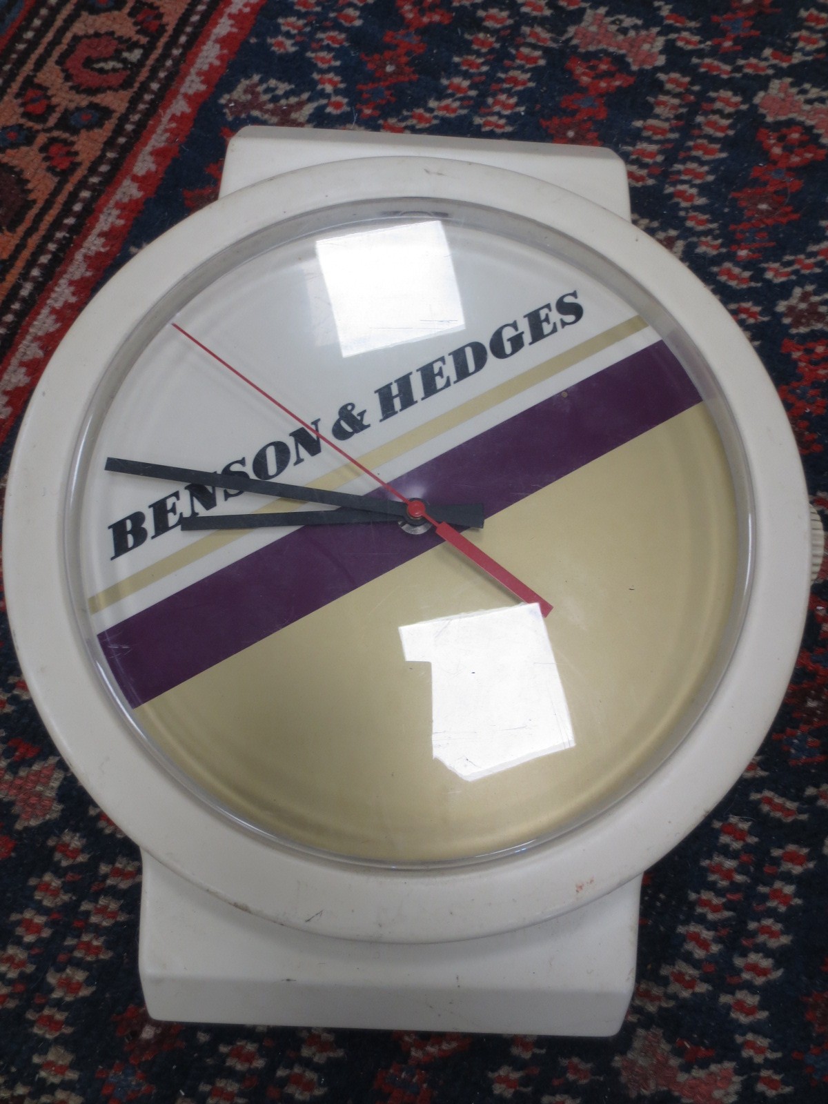 A vintage Benson & Hedges advertising clock in the form of a watch