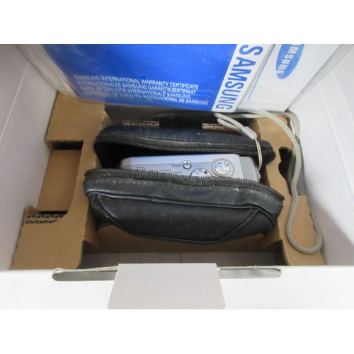A Samsung Digimax A7 digital camera in box, a vintage Cosmic 35 Soviet ...