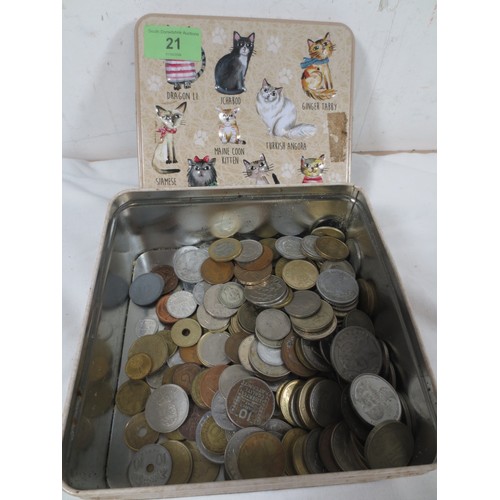A decorative cat tin of mixed world coins includes some silver