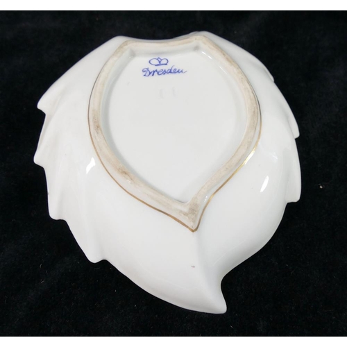 An Augustus Rex porcelain teacup and saucer, and a larger similar ...