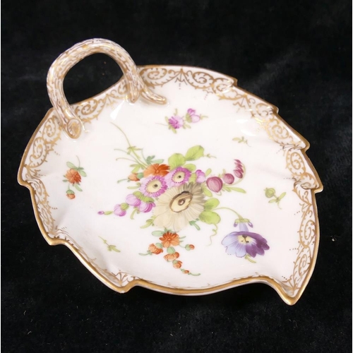 An Augustus Rex porcelain teacup and saucer, and a larger similar ...