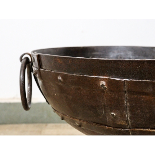 Metal 'Kadai' fire pit of riveted construction on iron stand ...