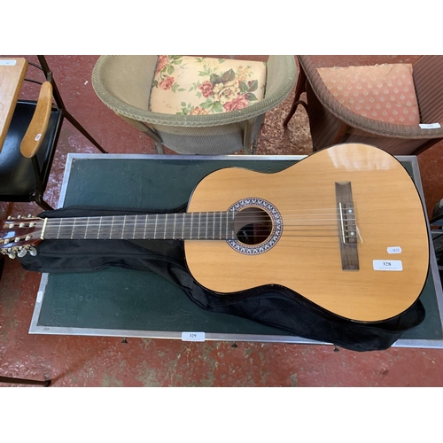 A Jose Ferrer El Primo acoustic guitar and case