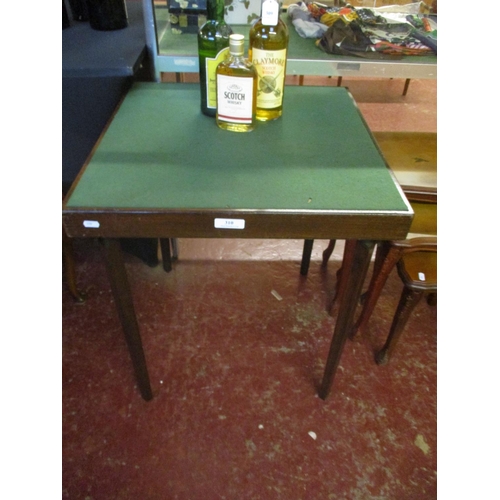 A vintage folding bridge table