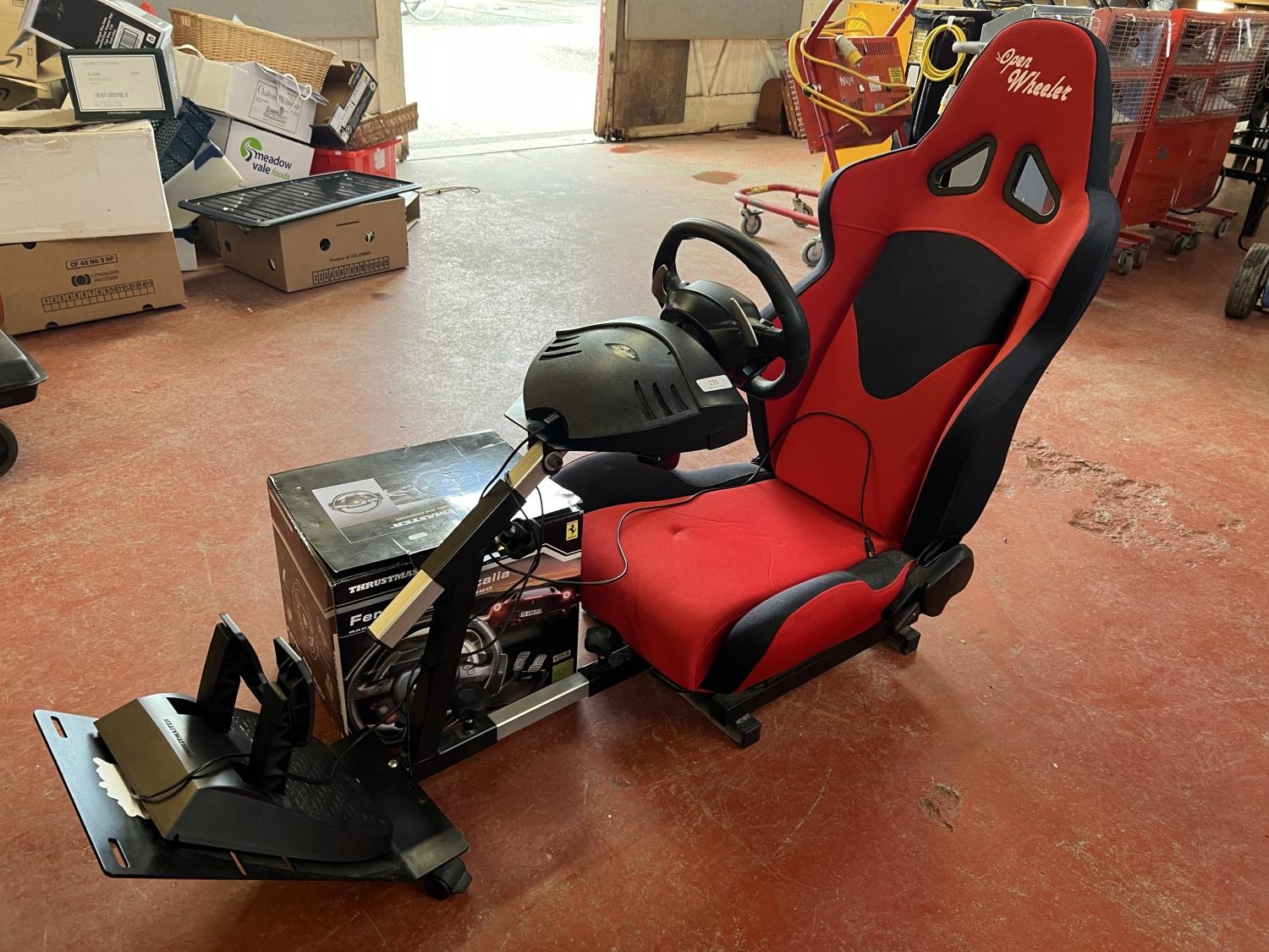 An open wheeler gaming chair and Thrustmaster driving console