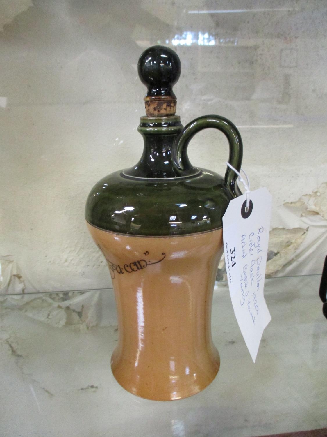 An early twentieth century Royal Doulton cider flagon by Bessie Young