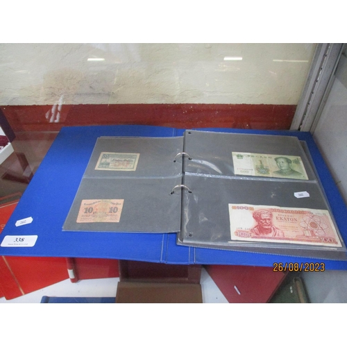 A collection of 50 vintage bank notes and tokens