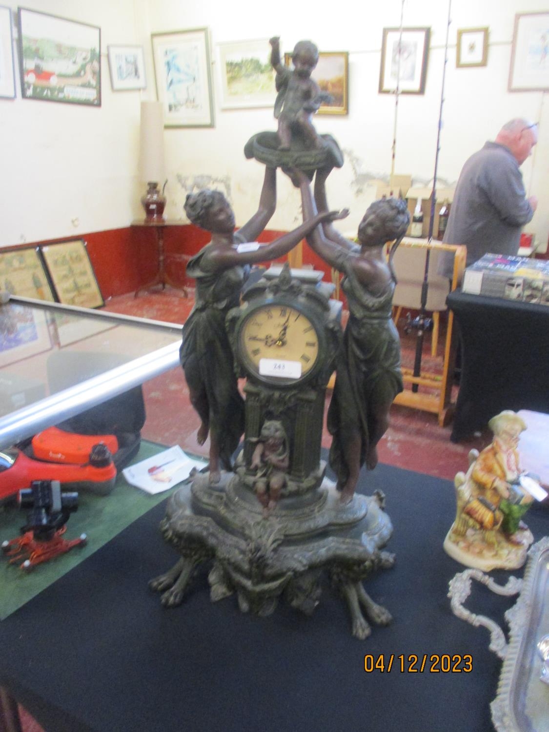 A spelter figural mantle clock by Juliana