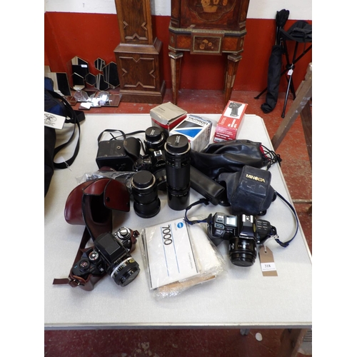 Assorted cameras by Nikon, Canon and Minolta together with various lens ...