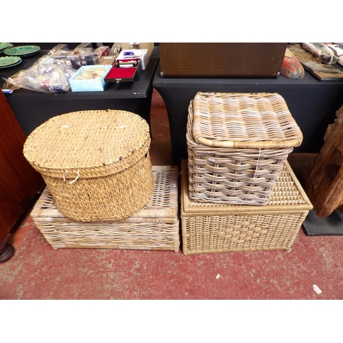 Four wicker hampers