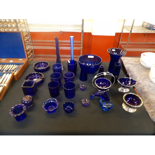 A collection of blue glass ware
