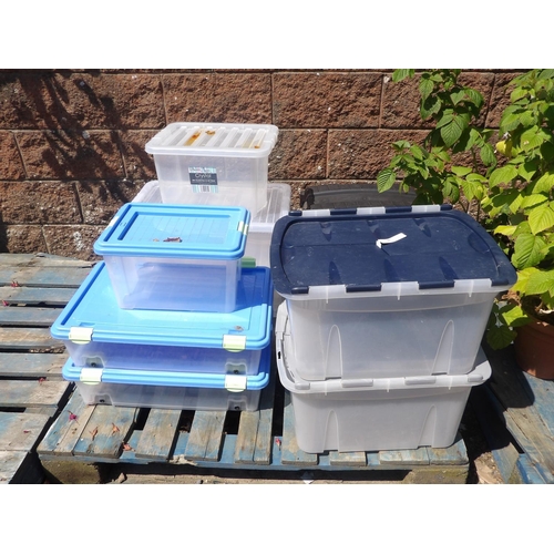 Assorted plastic storage boxes and crates