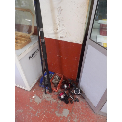 An Okuma 3.6m beachcaster fishing rod, three fixed spool fishing reels ...